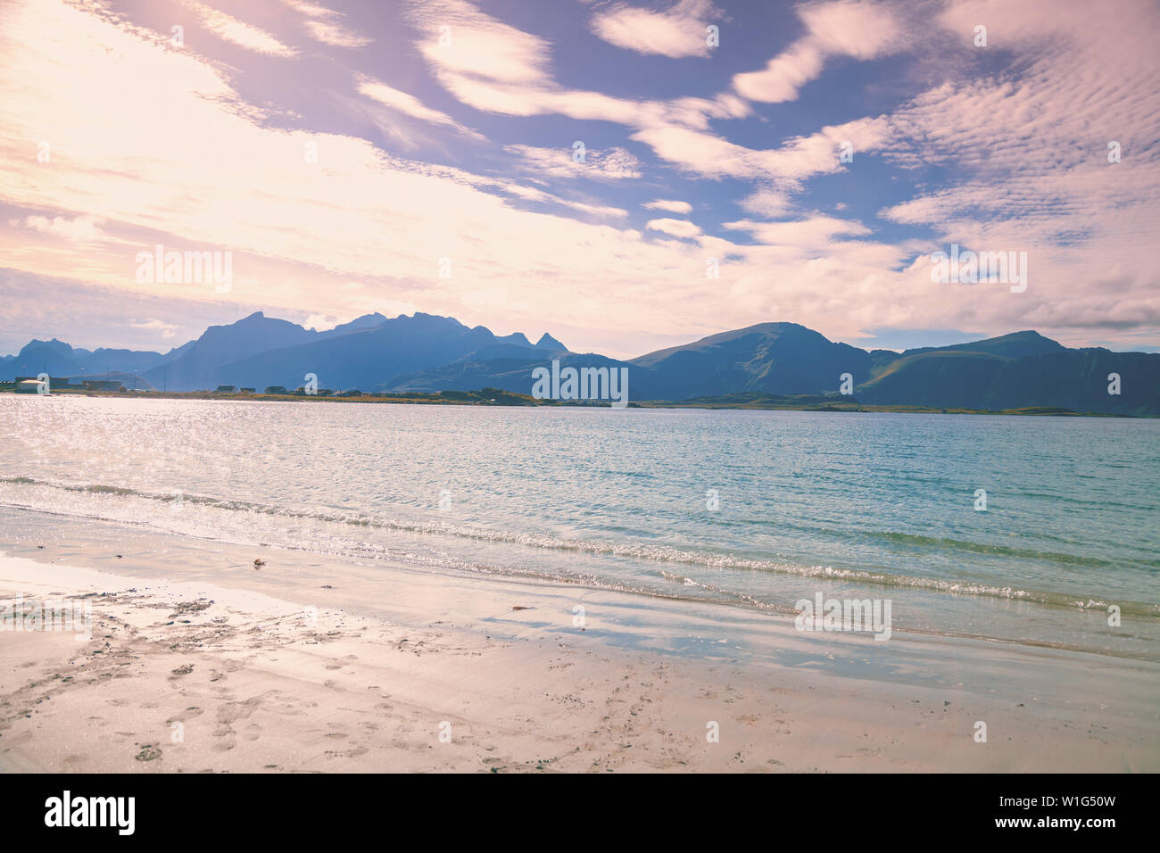 Fjord at sunset Rocky beach in the evening. White sand beach. Beautiful ...