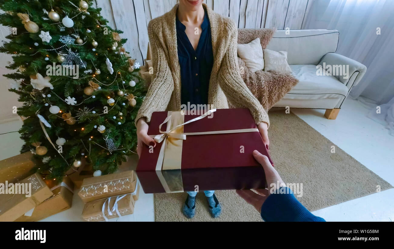 Woman giving gift box Stock Photo - Alamy