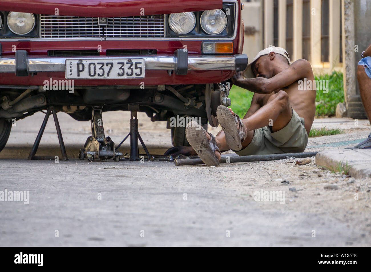 Havana, Cuba - May 17, 2019: Dirty Cuban Car Mechanic is working ...
