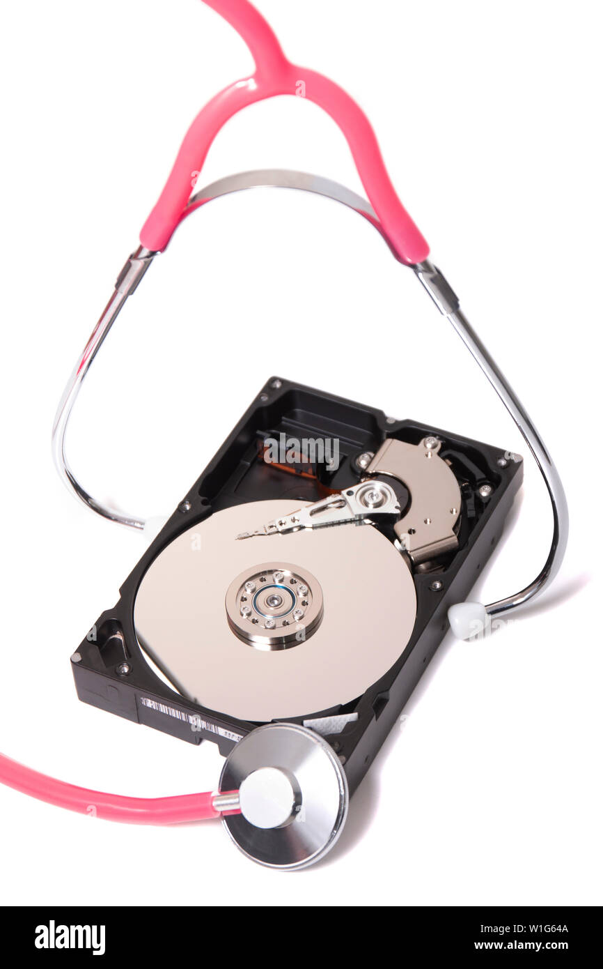 Close up view of a computer hard drive with pink stethoscope concept ...