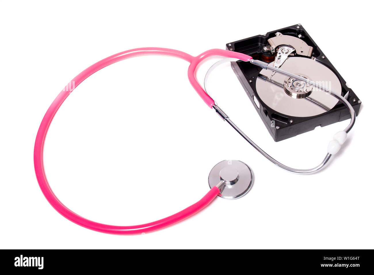 Close up view of a computer hard drive with pink stethoscope concept ...