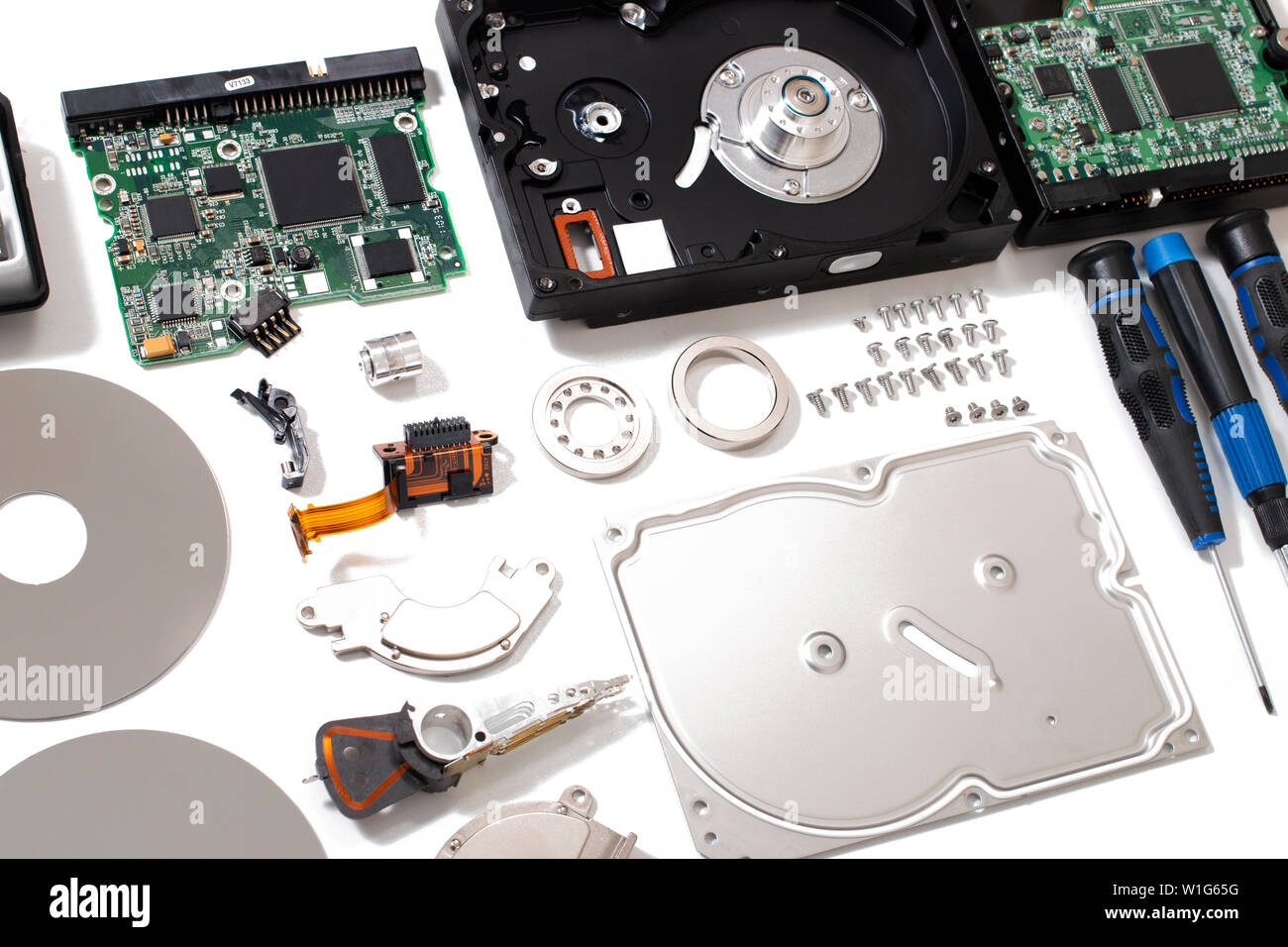 Disassembled hdd drive parts isolated on a white background Stock Photo ...