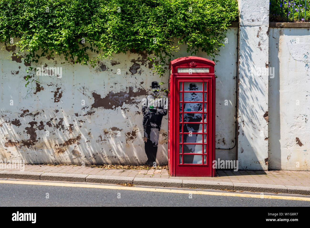 Banksy-style artwork of Edward Elgar in an old Telephone Box below the ...