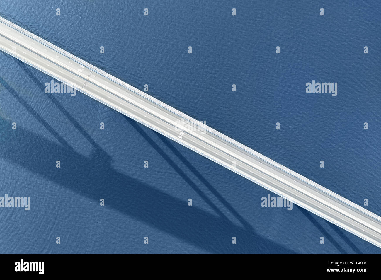 Long empty bridge over large river or sea aerial top view with long ...