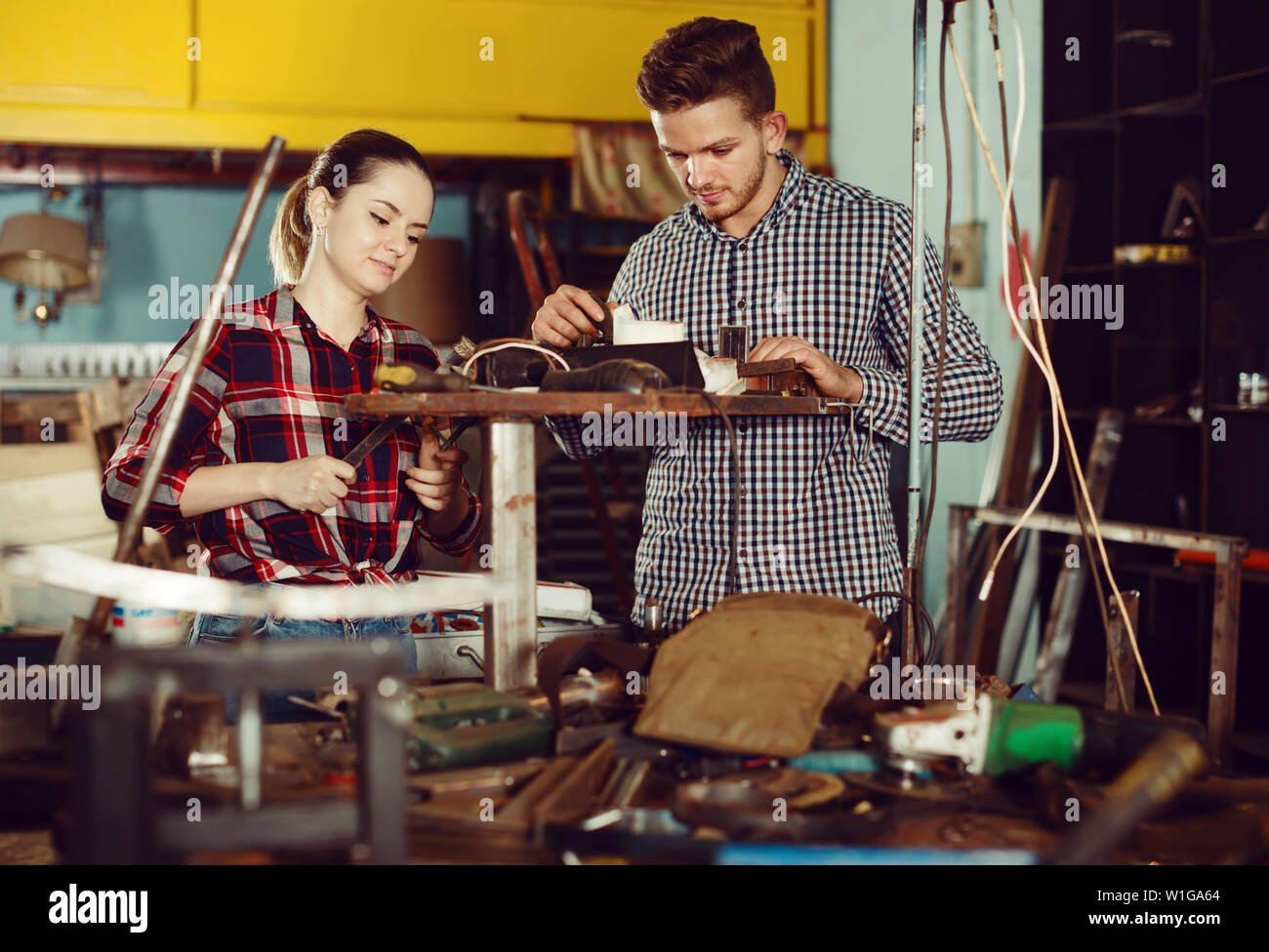 engineers who are standing on workplace in workshop Stock Photo - Alamy
