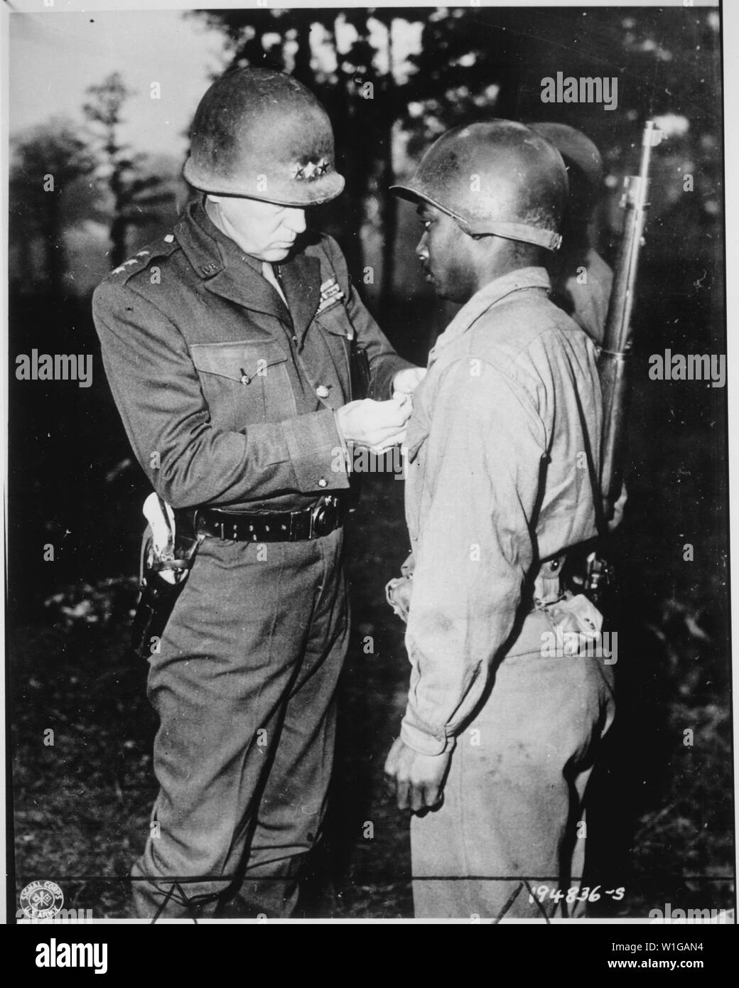 Lt. Gen. George S. Patton, U.S. Third Army commander, pins the Silver ...