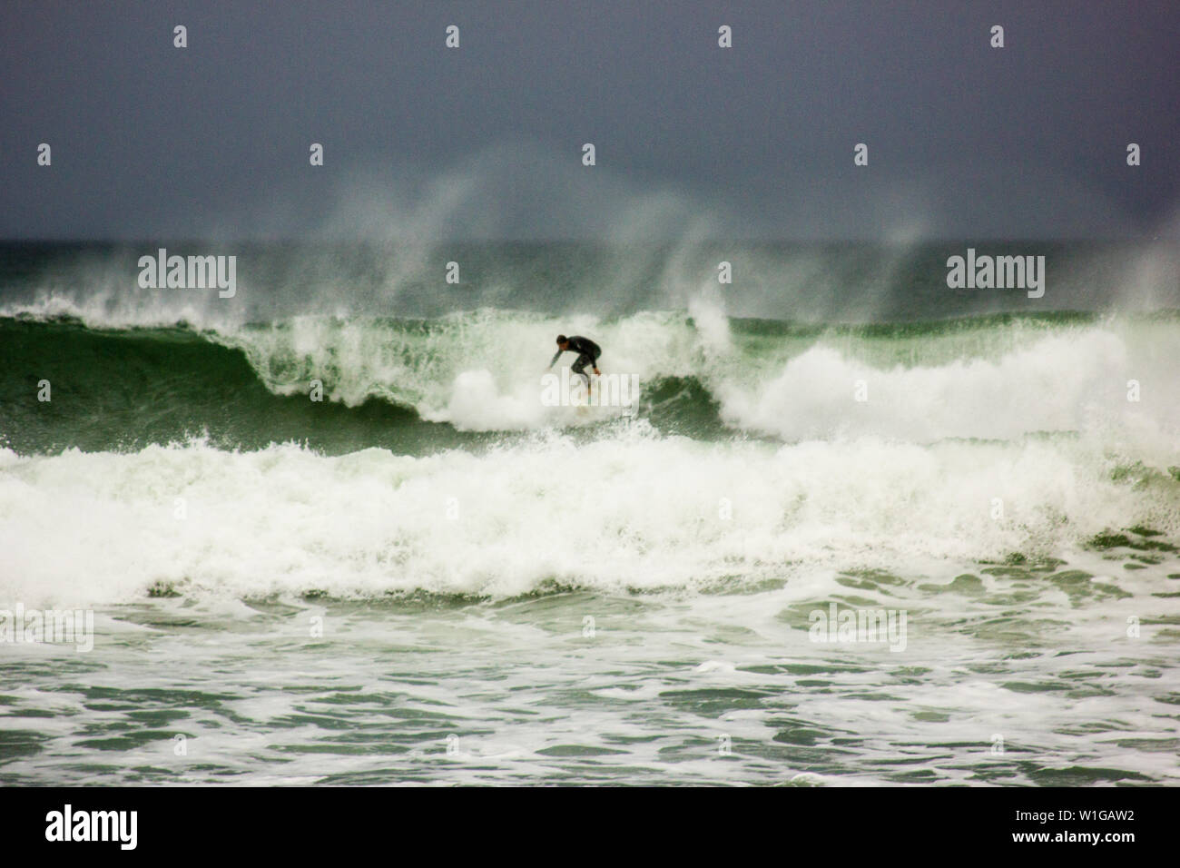 storm surf beach sea surfboarding Stock Photo - Alamy