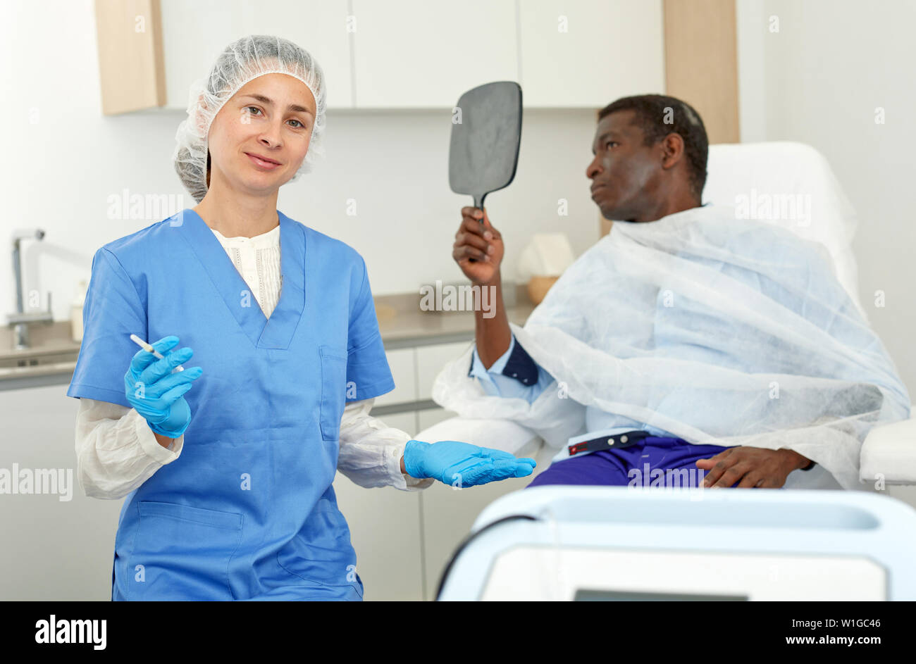 Cosmetician female preparing to aesthetic facial injection with man in ...