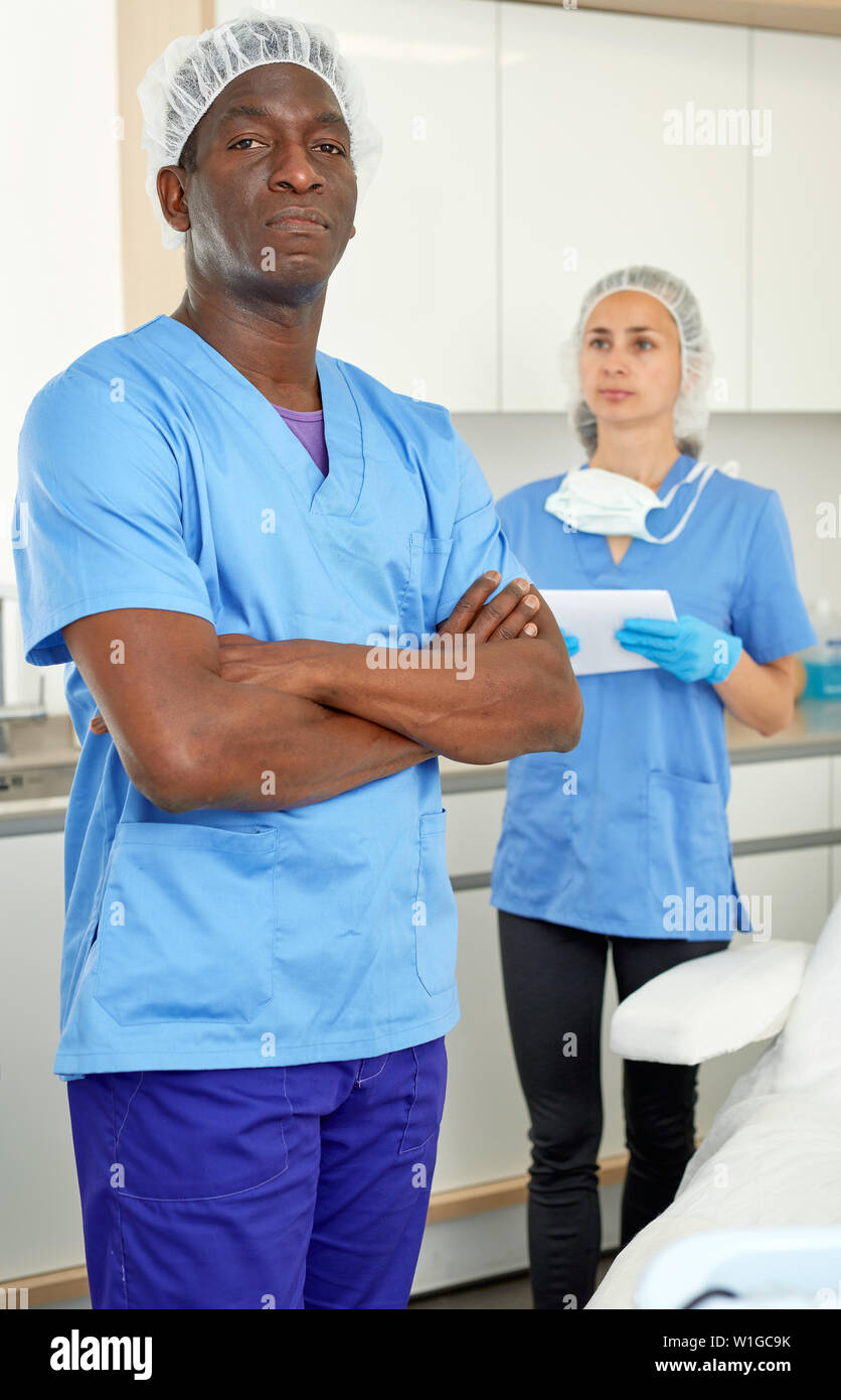 Cosmetician man before procedure in clinic of esthetic cosmetology ...