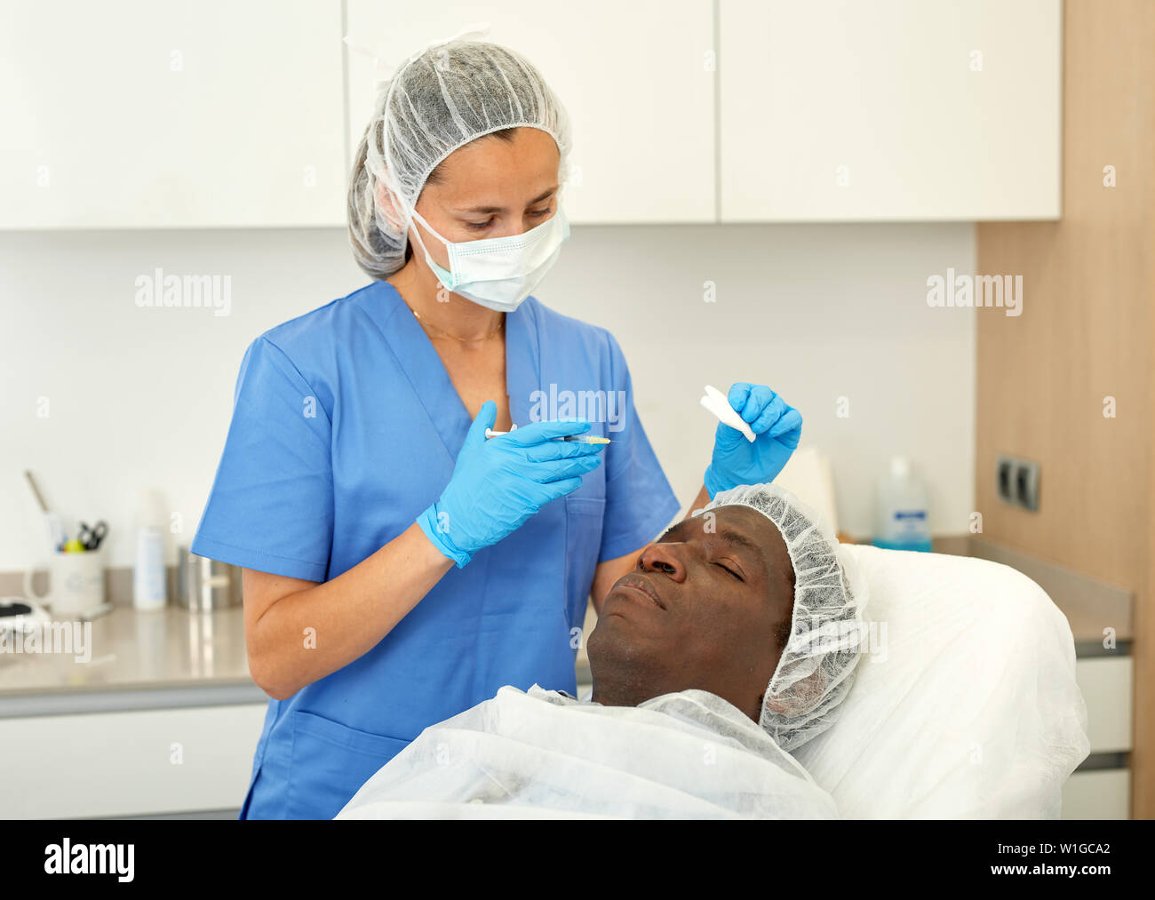 African female during cosmetic hi-res stock photography and images - Alamy