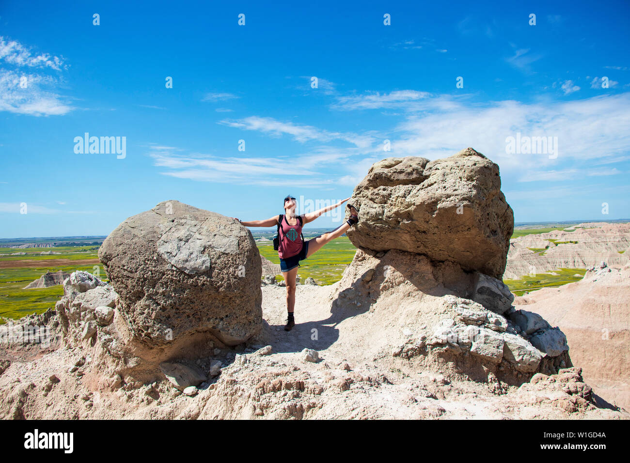 Woman posing on rocks mountain hi-res stock photography and images - Alamy