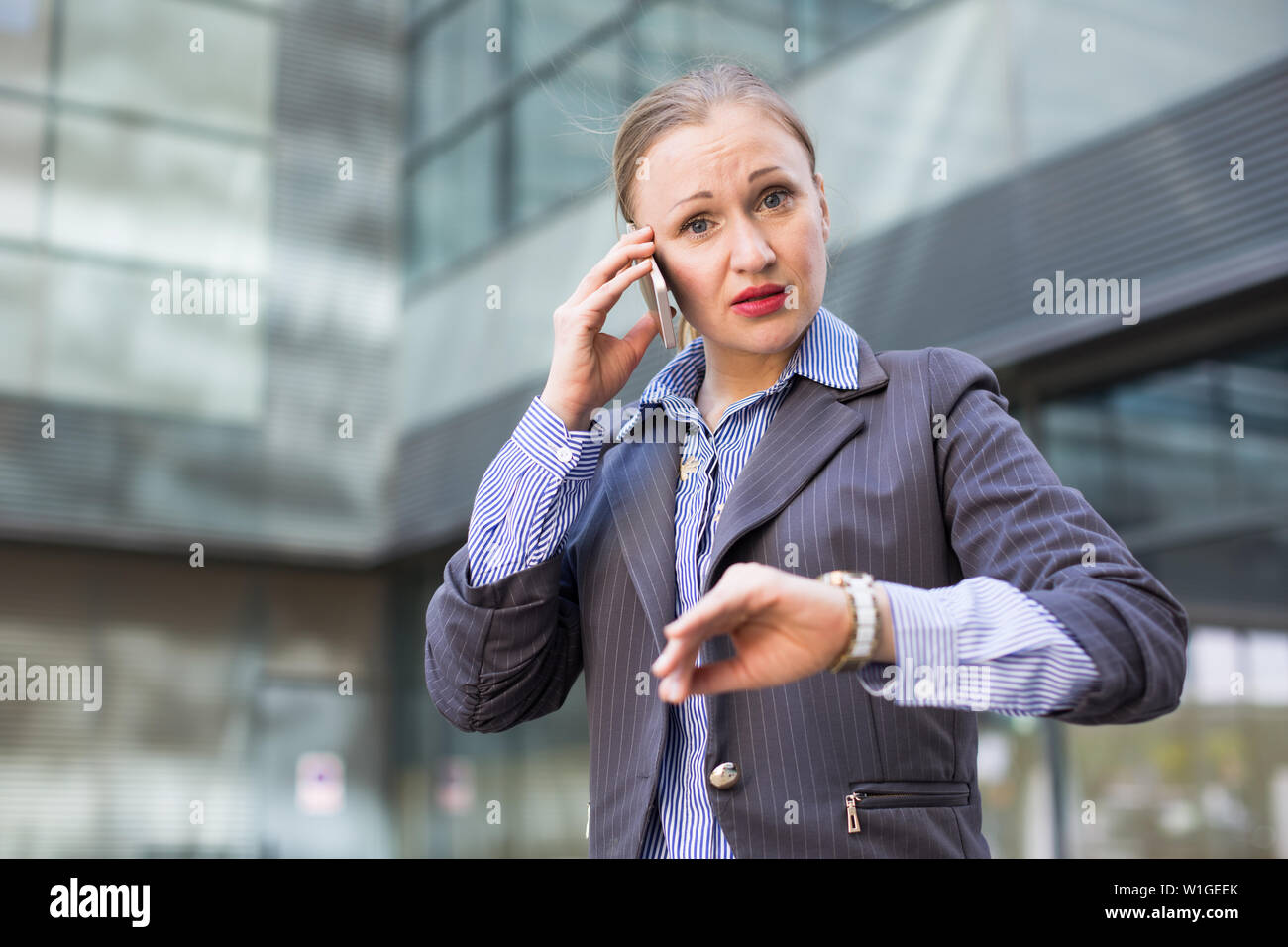 Portrait of busy female in suit rushing to important meeting Stock ...