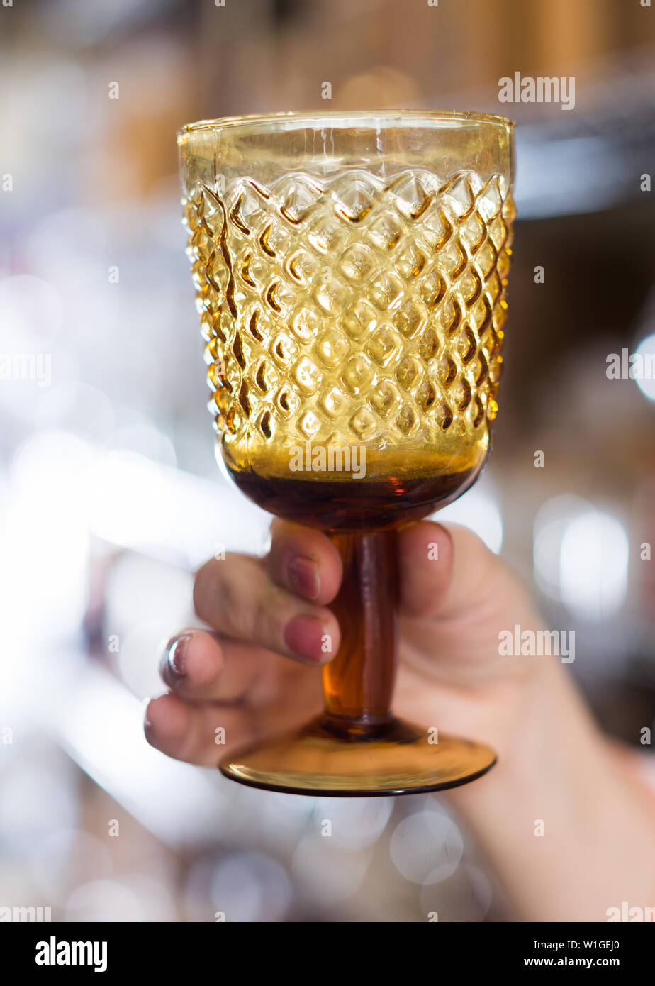 hand with crystal glass for wine collection in the dishes shop Stock ...