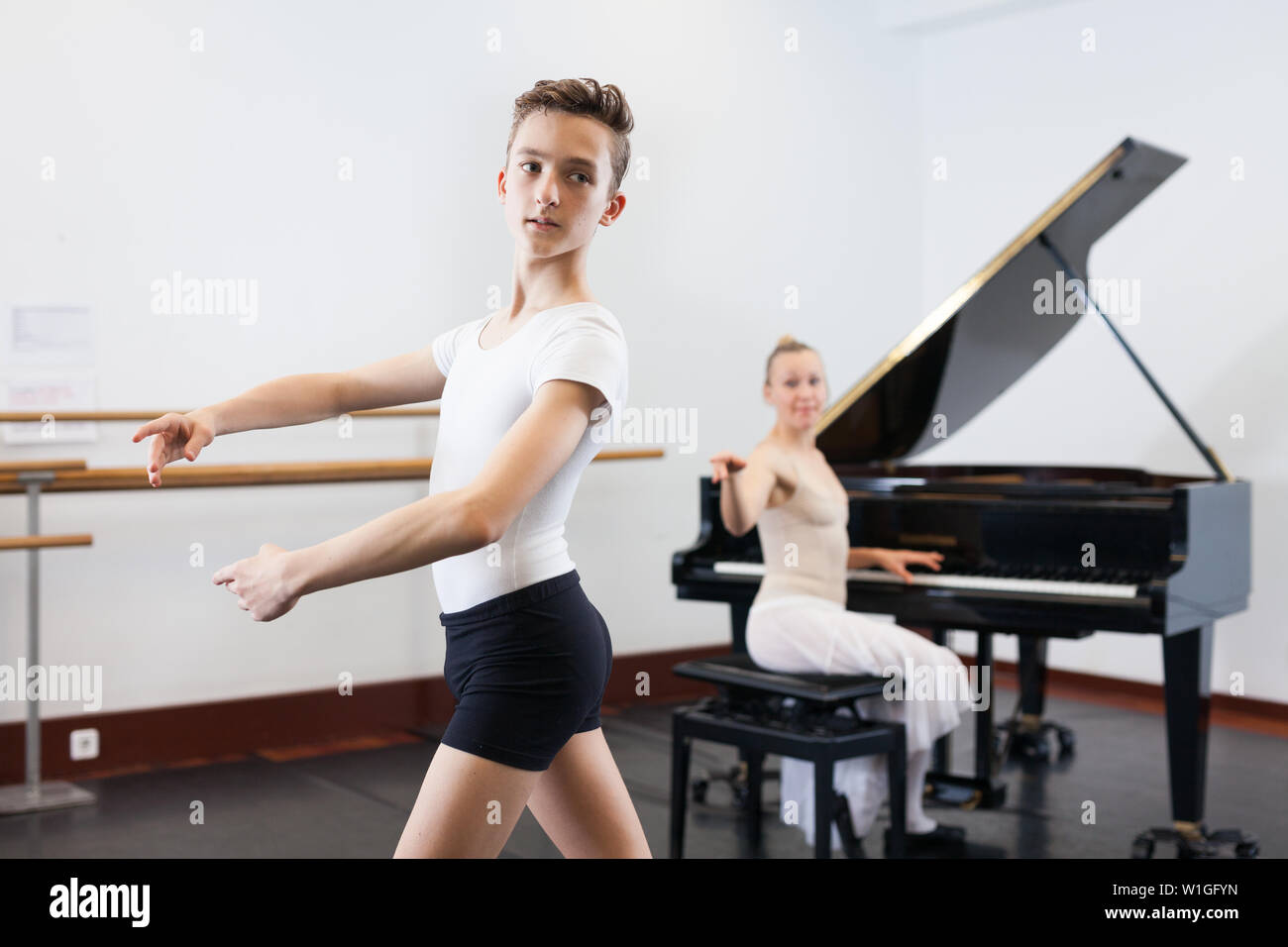 Female choreographer teaches young dancer in ballet studio Stock Photo ...