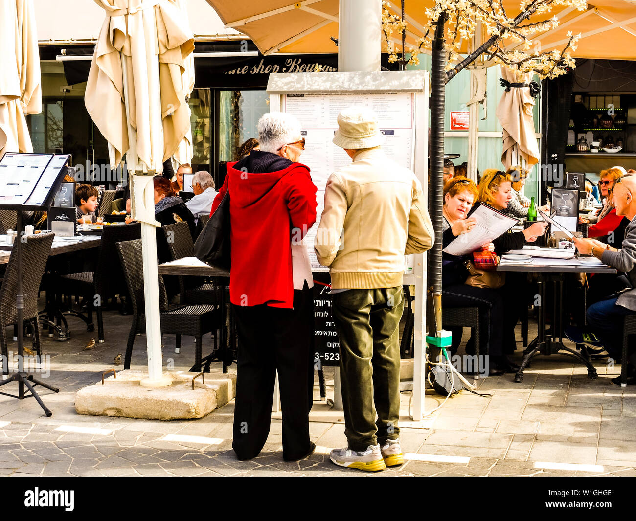 Senior man reading menu hi-res stock photography and images - Alamy