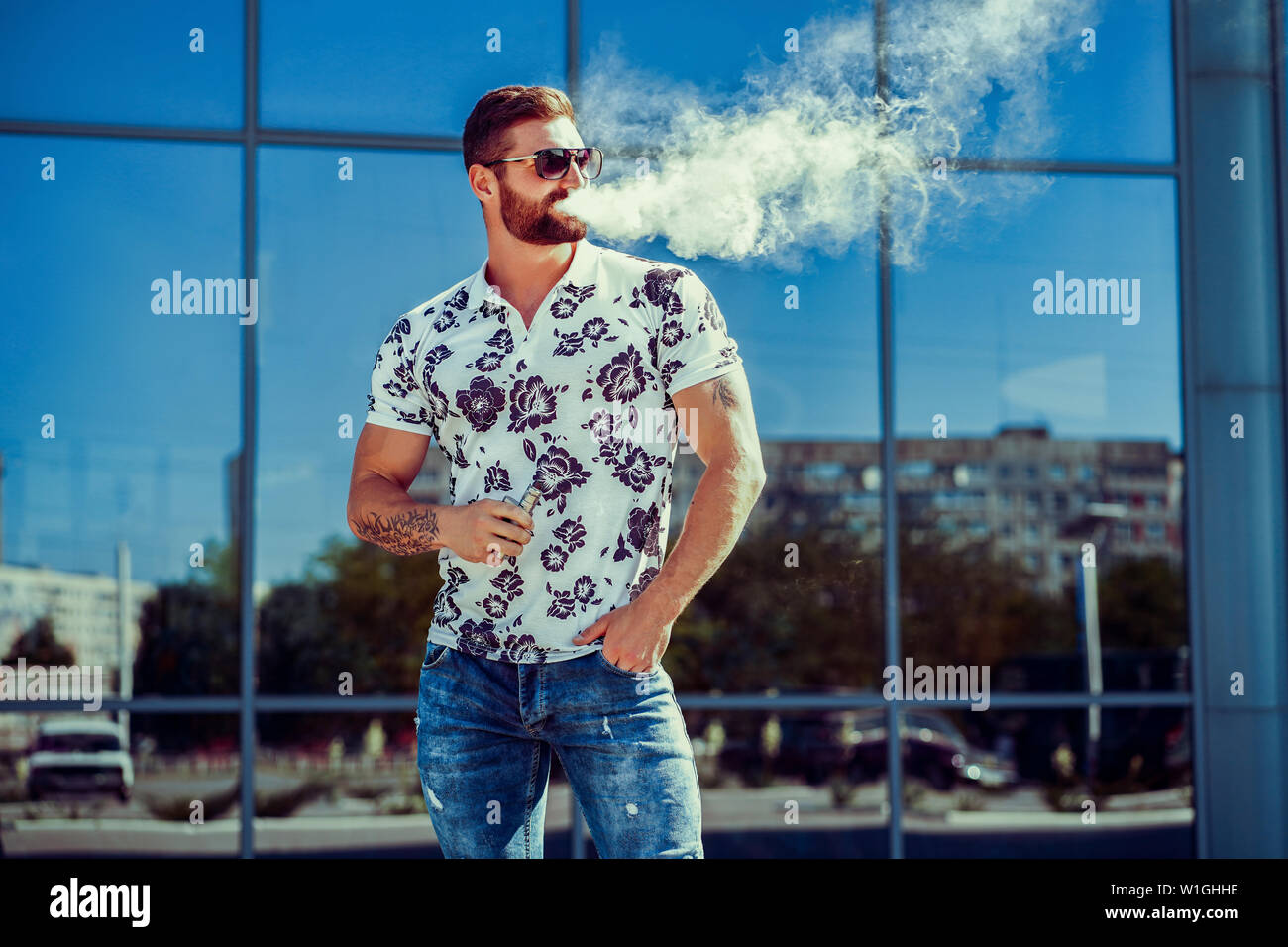 Men with beard vaping outdoor in sunglasses, focus on steam Stock Photo ...