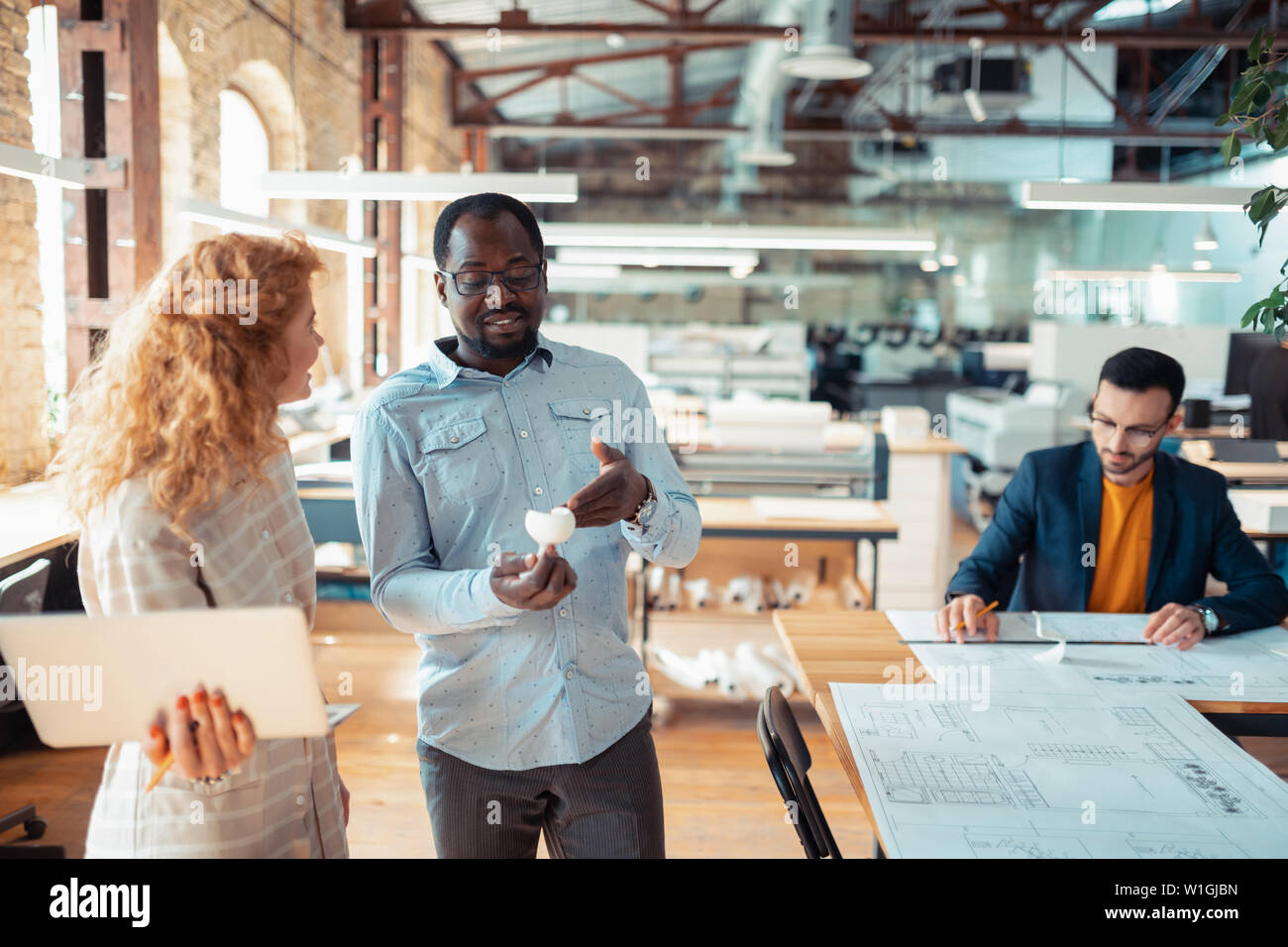 Leader of project. Dark-skinned mature leader of design project ...