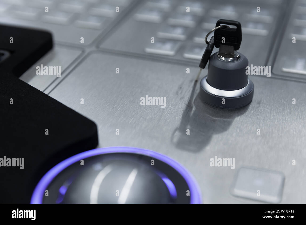 Industrial control panel made of gray metal with blue trackball ...