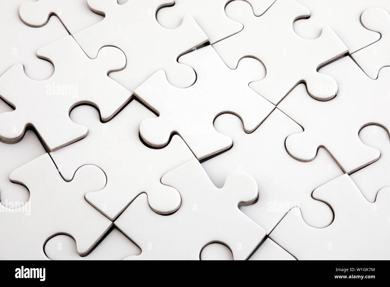 Top view of white jigsaw puzzle Stock Photo - Alamy