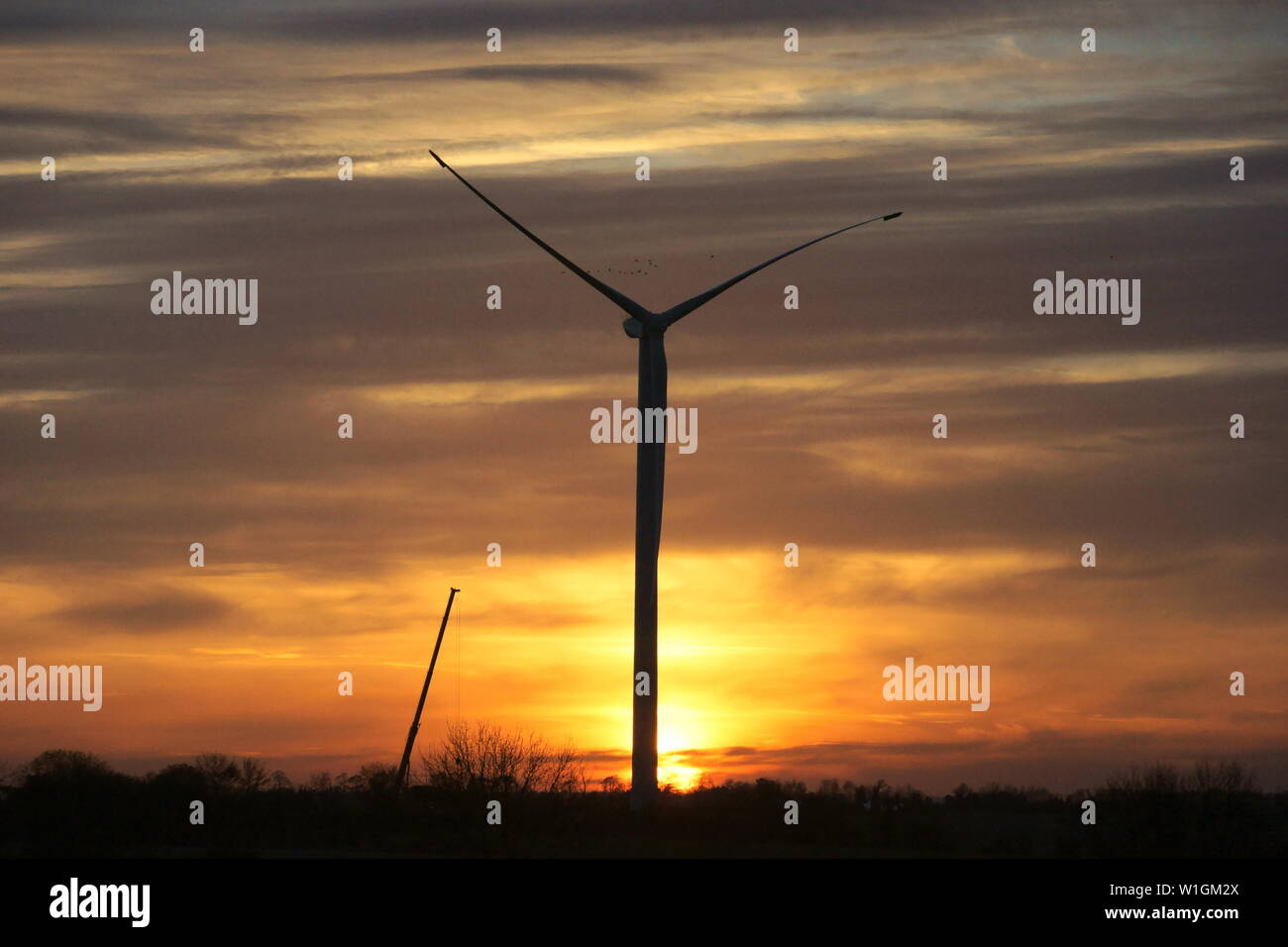 Power Wind turbine, sunset Stock Photo - Alamy