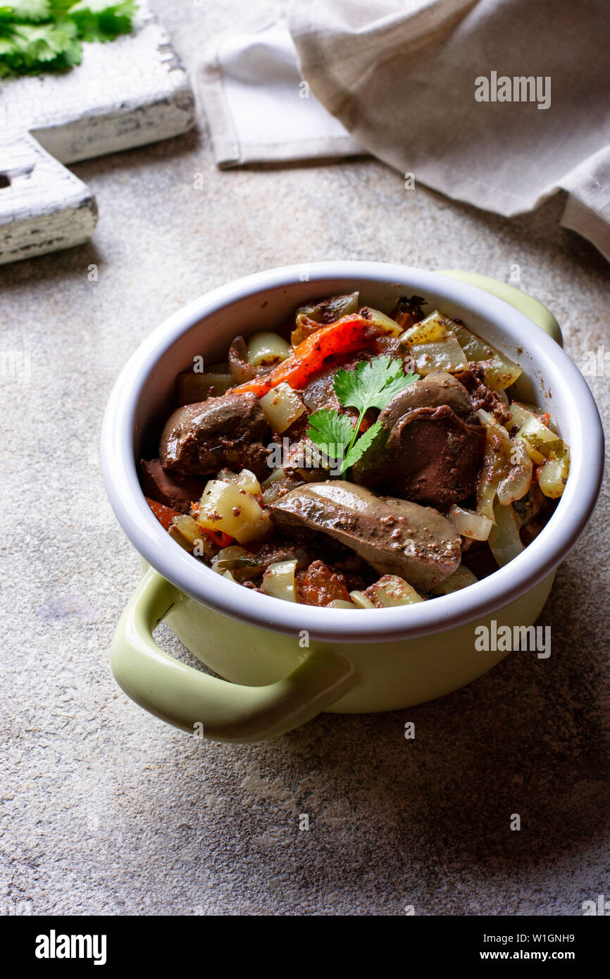 Stewed chicken liver with vegetables Stock Photo - Alamy
