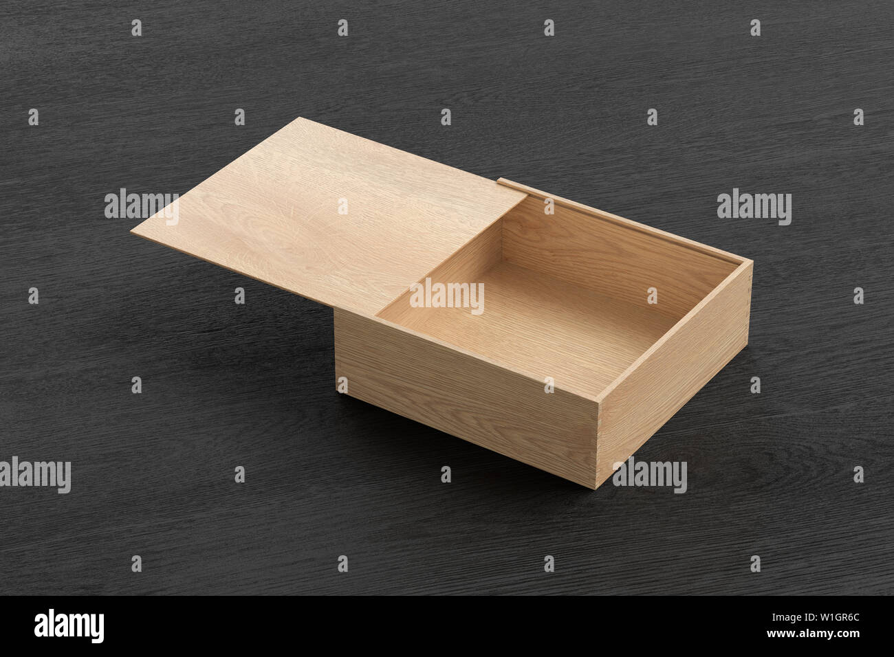 Wooden opened square box with sliding lid on black wooden background ...