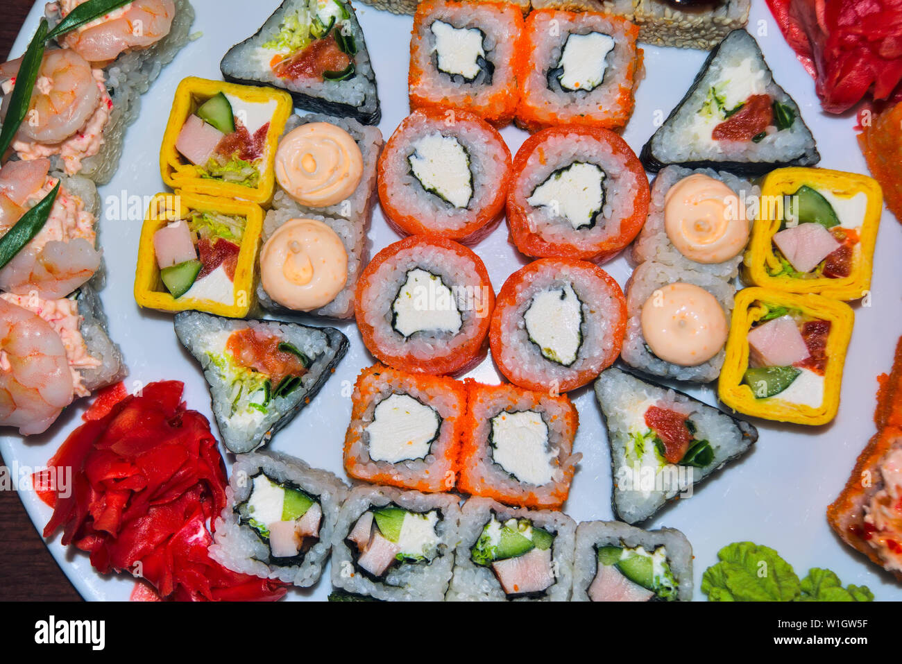 Large plate of various sushi with fish,seafood, and white rice. Plate ...