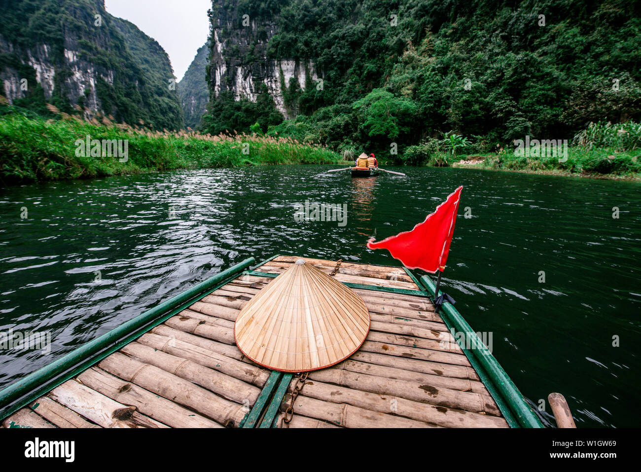 Boat cave tour in Trang An Scenic Landscape formed by karst towers and ...
