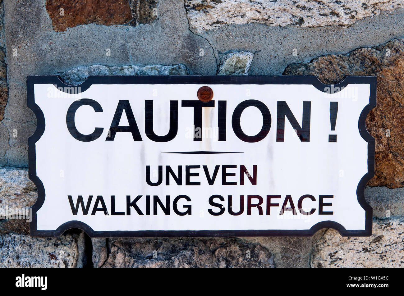 A sign on Whiteface Mountain USA showing that is is an uneven walking ...