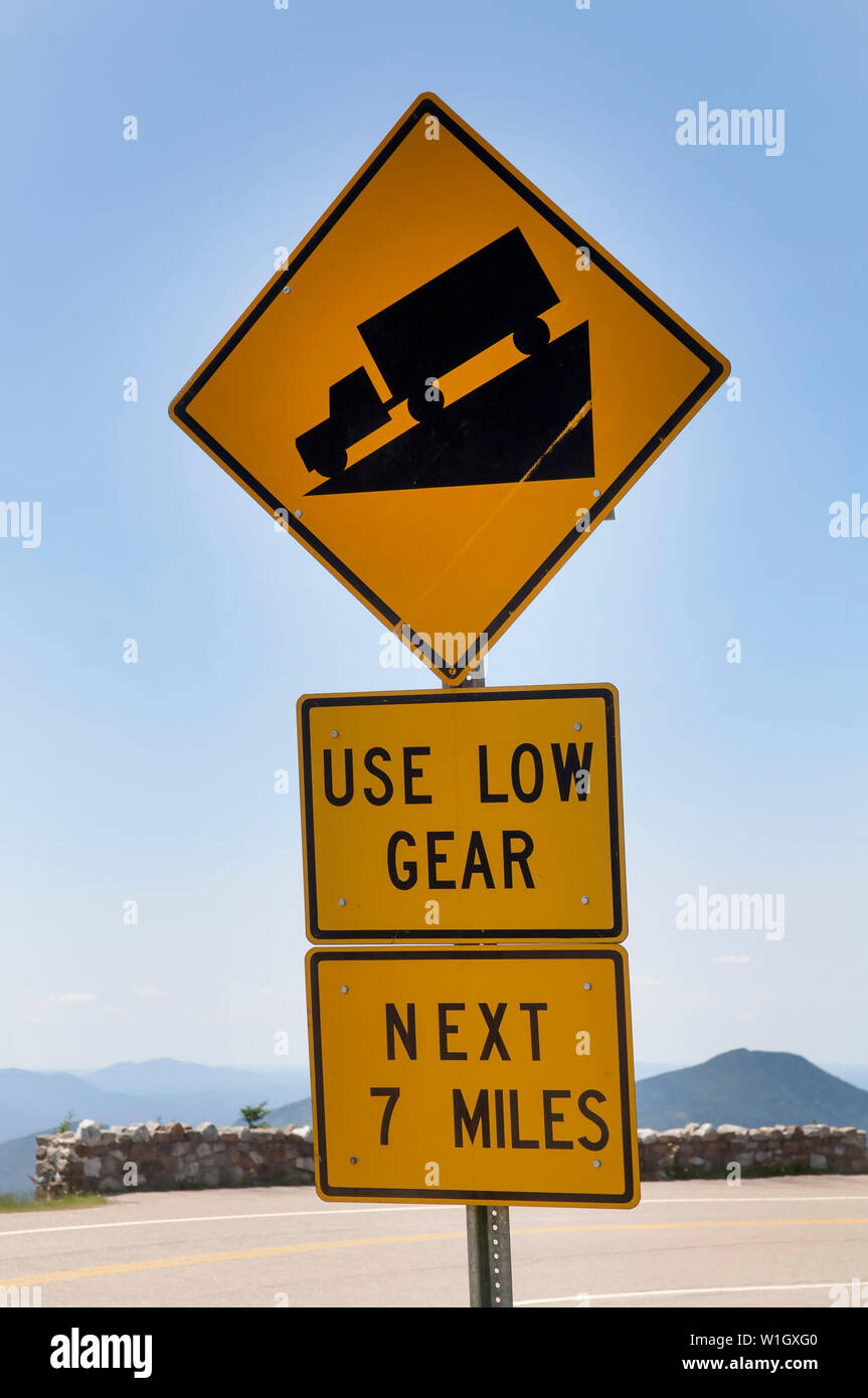 A road sign warning lorries to use low gear as the the road is very ...