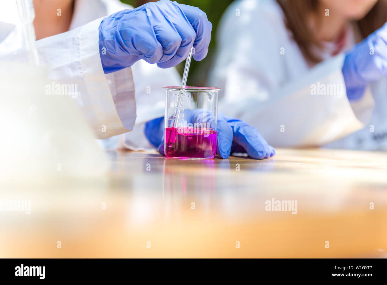 close up of scientist holding flask with chemical Stock Photo - Alamy