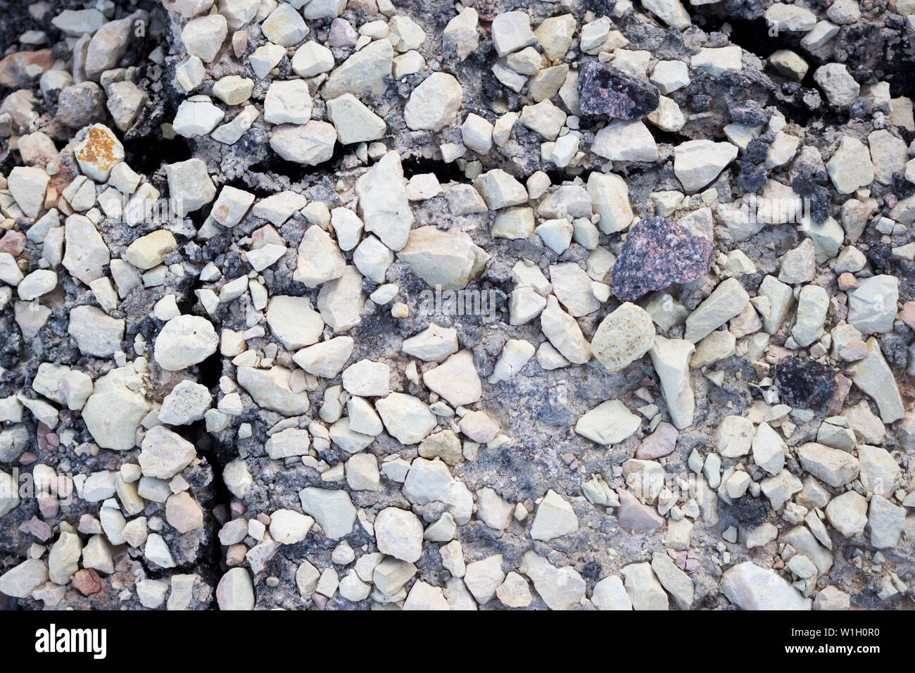 asphalt layer, view from the back. stones gravel fused into the asphalt ...