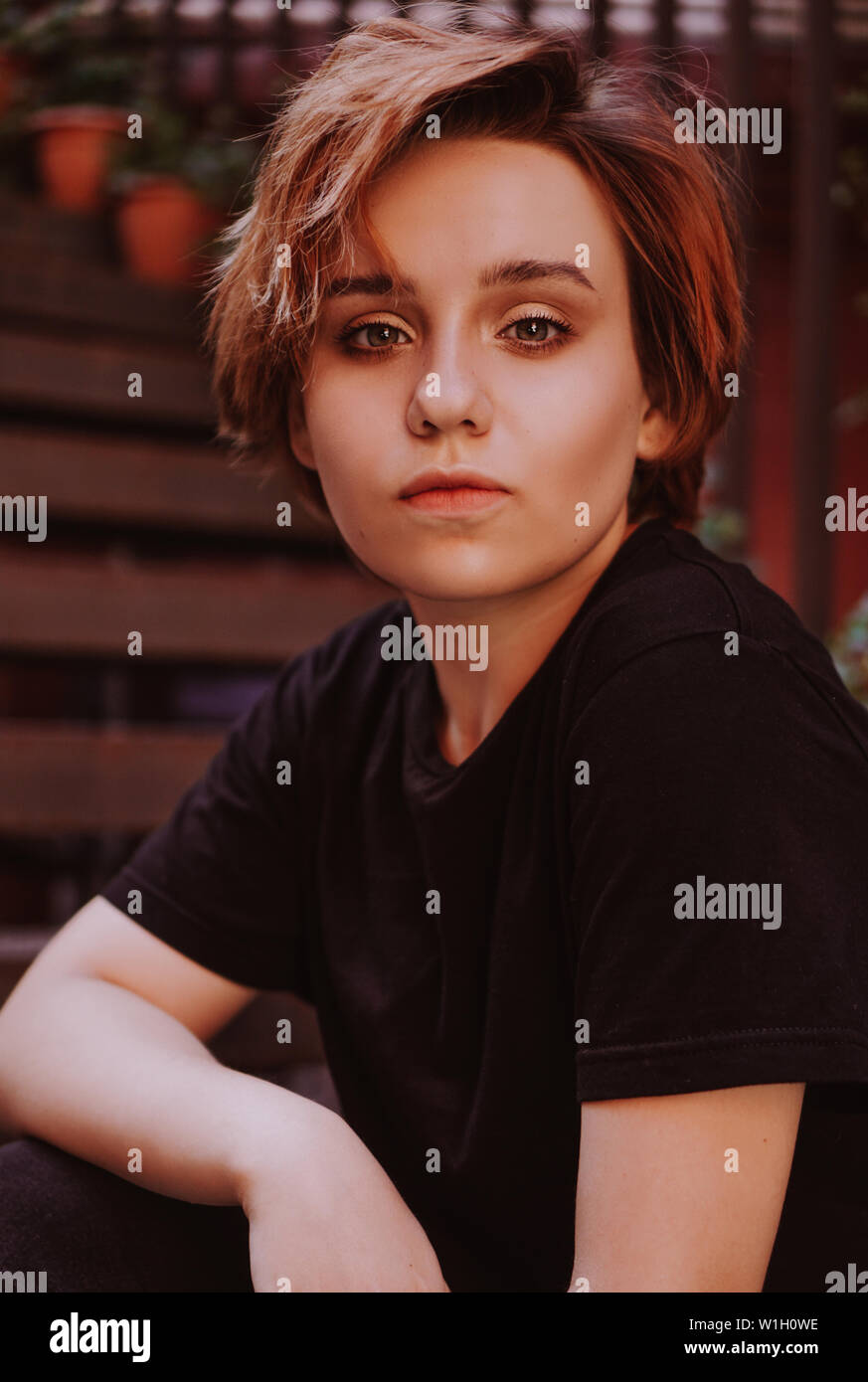 Cheerful cheeky woman yellow background hi-res stock photography and ...