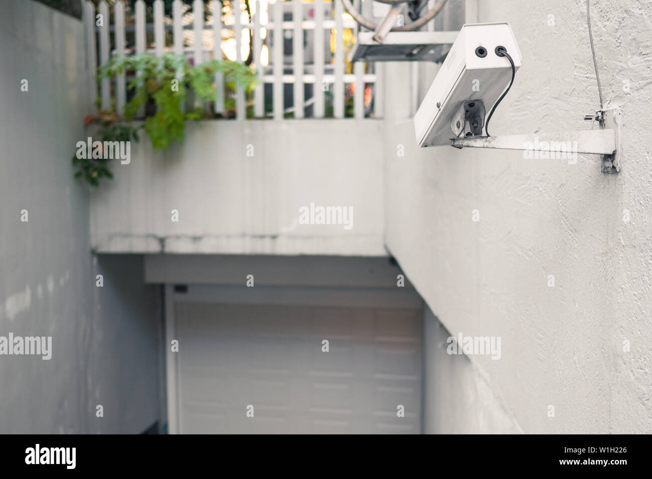 CCTV camera near the entrance to the garage Stock Photo - Alamy