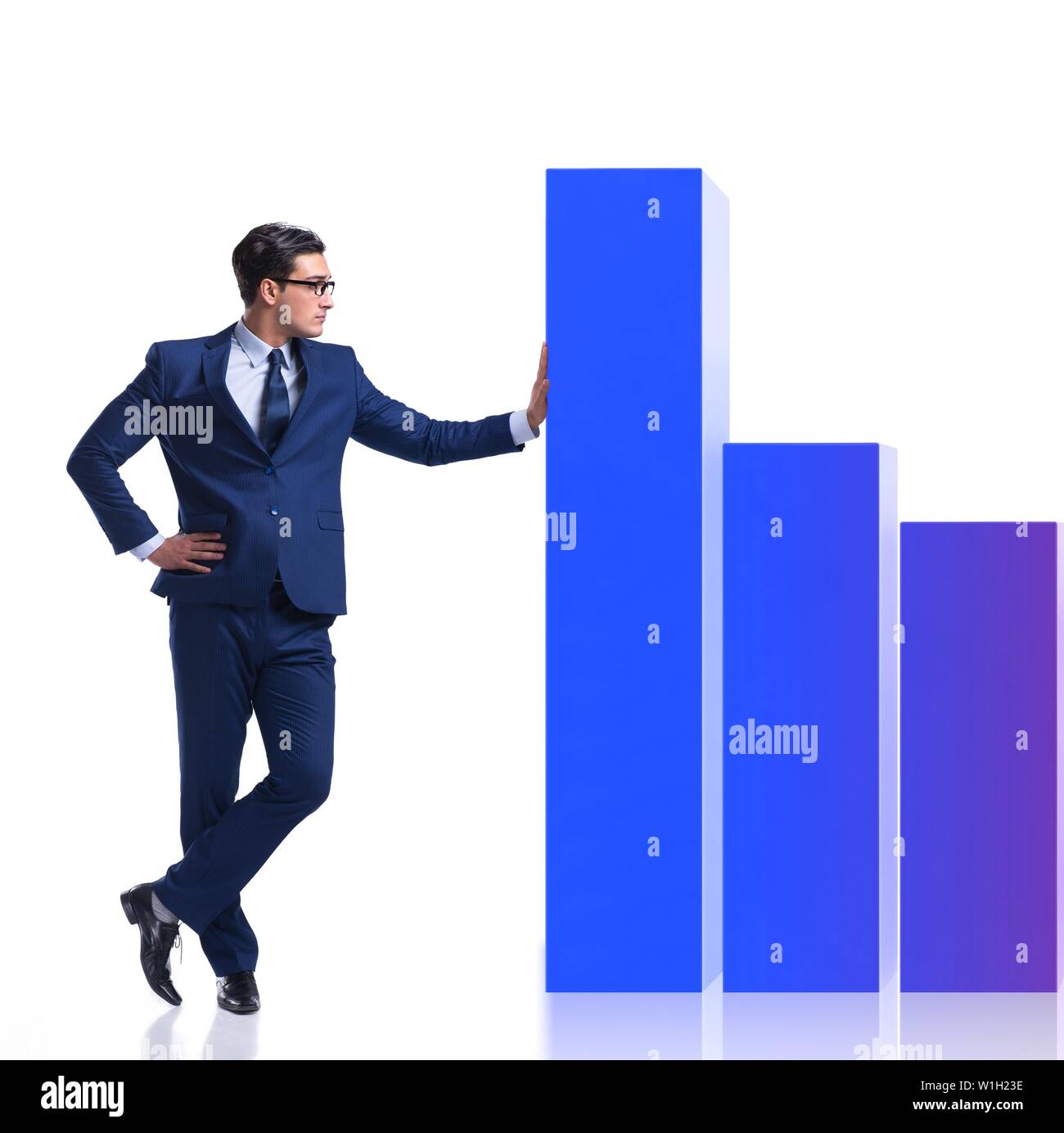 Businessman standing next to bar chart on white background Stock Photo ...