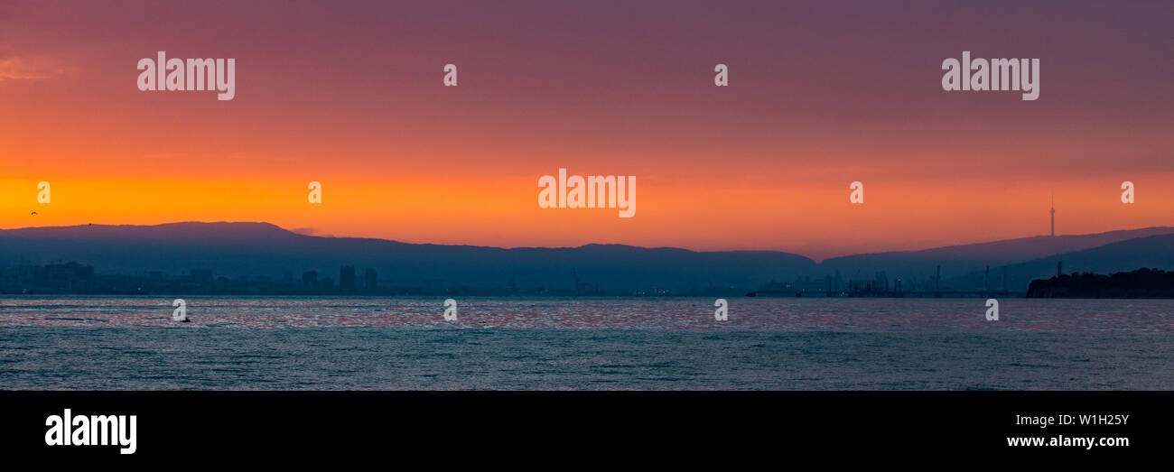 Bright red sunset sky over city and mountains. Fine landscape Stock ...