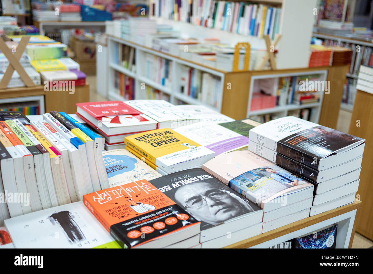 Seoul, South Korea - 23.02.2019: piles of books in a bookstore. Lots of ...