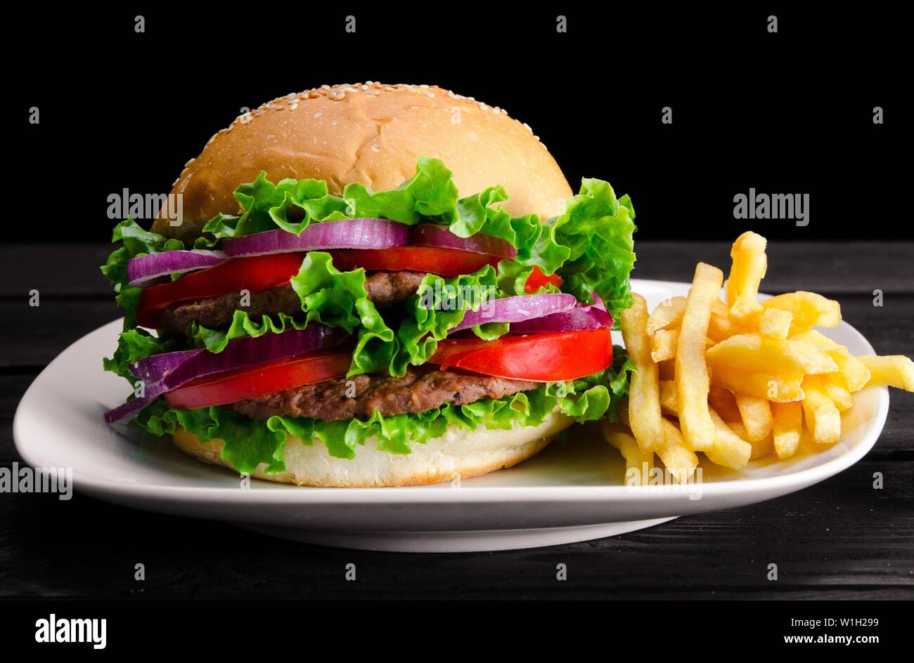 Burger served in bun in nutrition fast food concept Stock Photo - Alamy