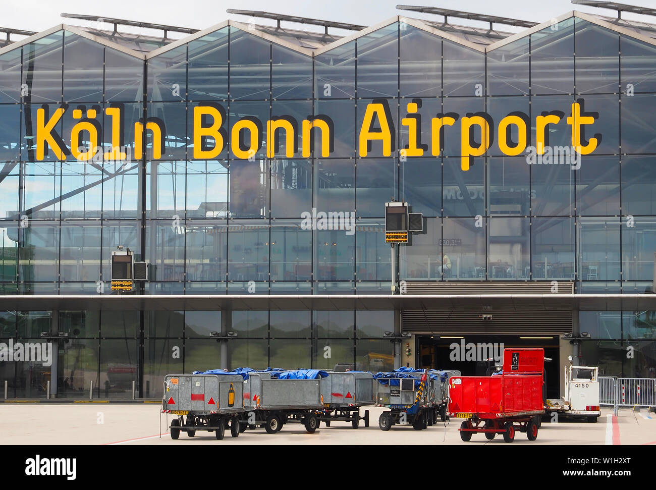 Terminal of Köln Bonn airport in Germany with luggage carts Stock Photo ...