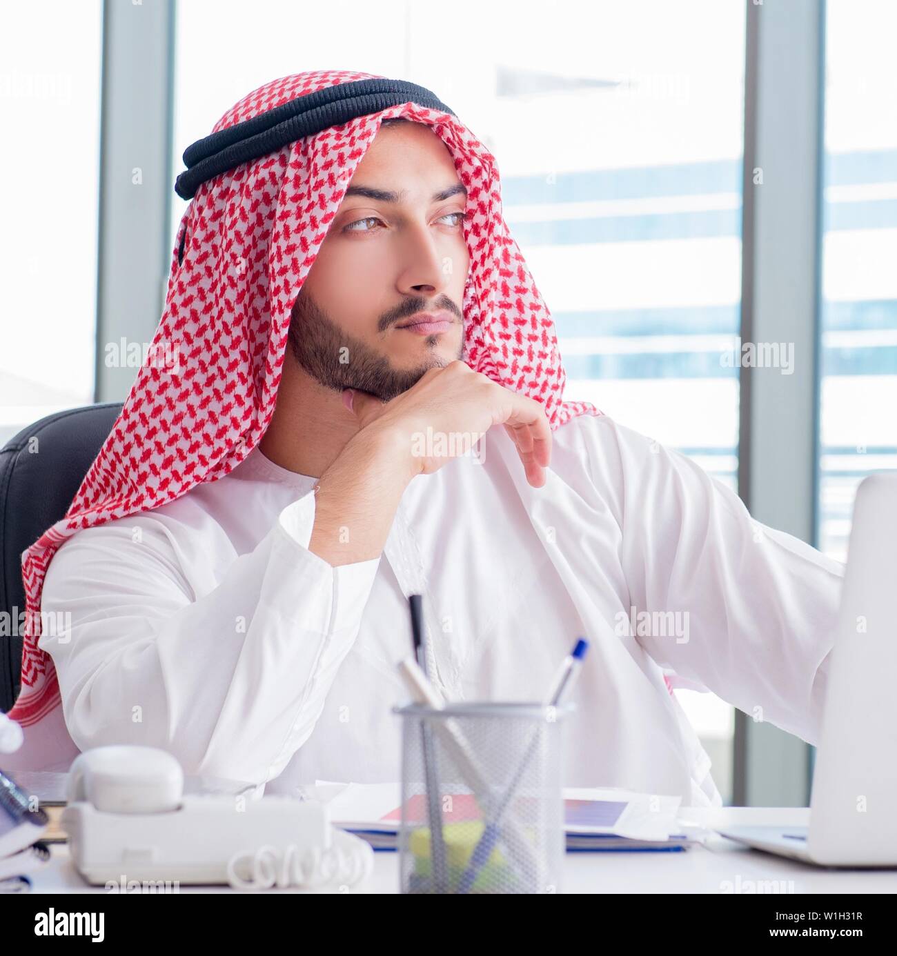 Arab businessman working in the office Stock Photo - Alamy