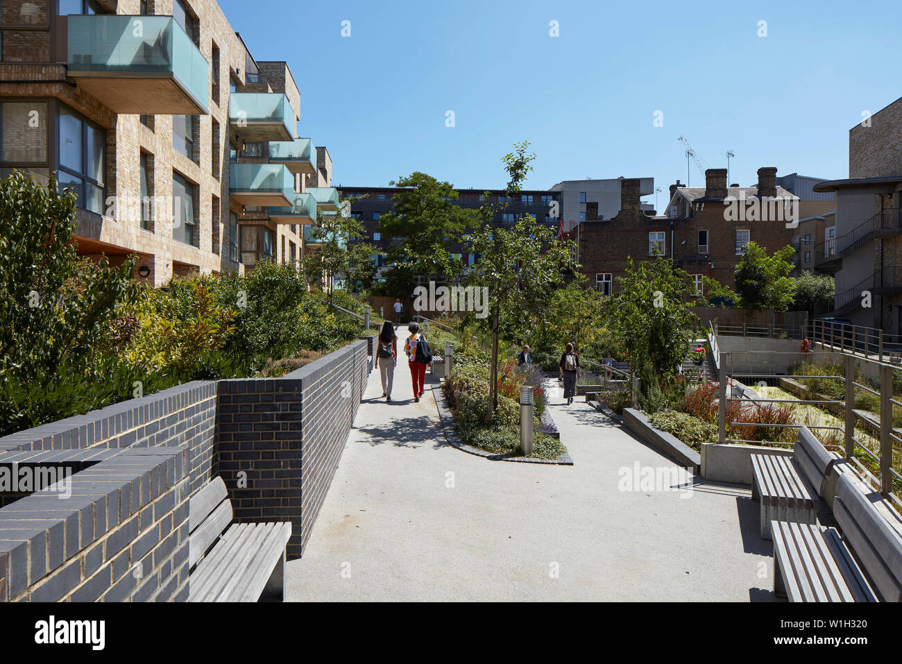 Garden walkways and bench seating. Stonebridge Park, London, United ...