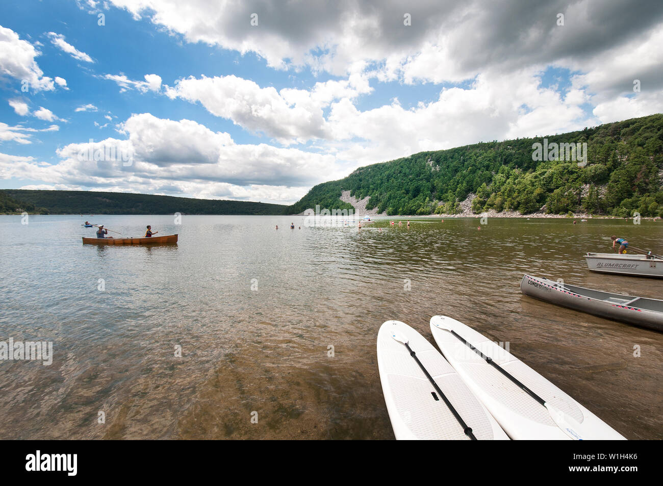 Watercraft float across the water of Devil's Lake State Park near ...