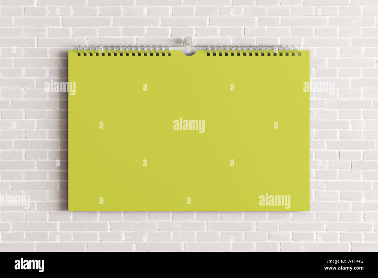 Blank horizontal yellow calendar mock up on the white brick wall. 3d ...