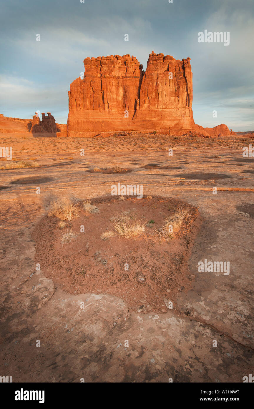 Desert sunrise at Courthouse Towers in Arches National Park near Moab ...