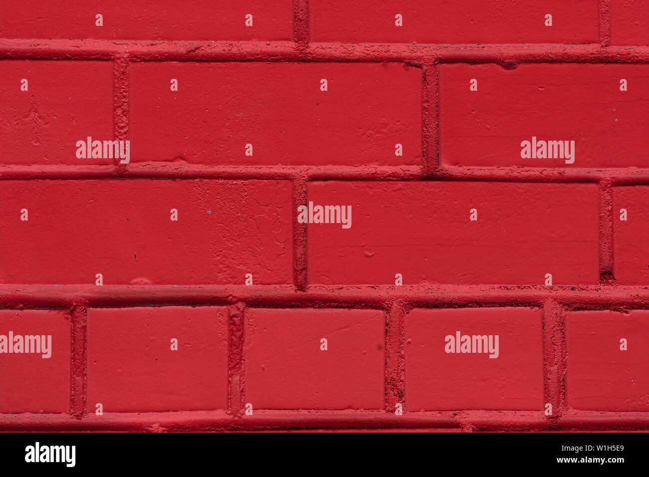 Painted red color brick wall surface. Modern background Stock Photo - Alamy