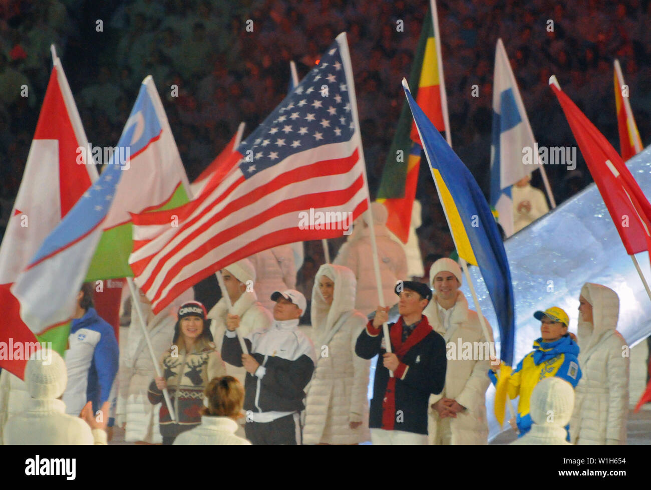 American flagbearer Billy Demong proudly waves the flat at the Closing ...