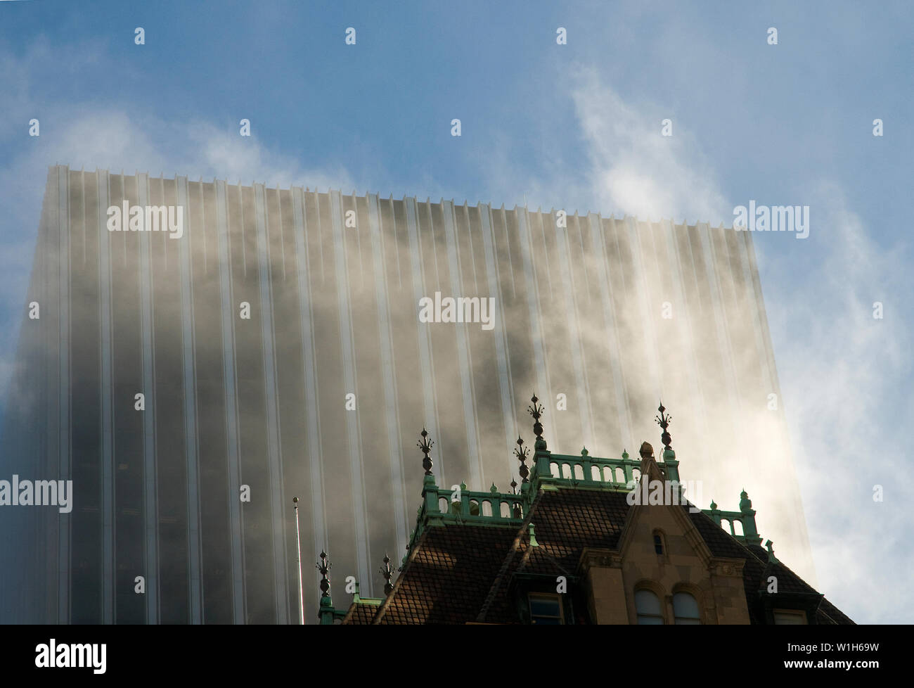 Fog floats around old and new buildings in downtown San Francisco, CA ...