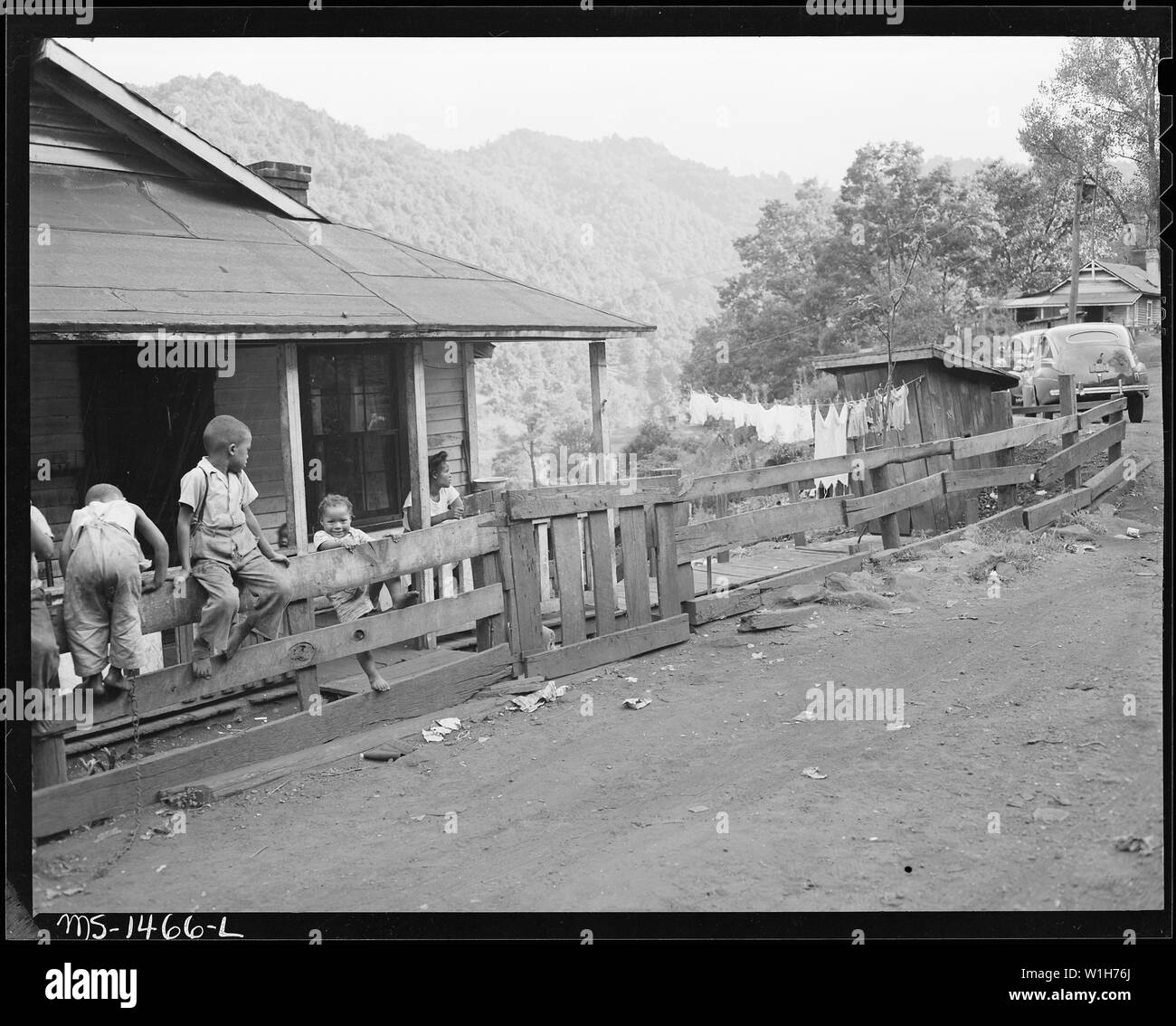 Neighboring house fence Black and White Stock Photos & Images - Alamy