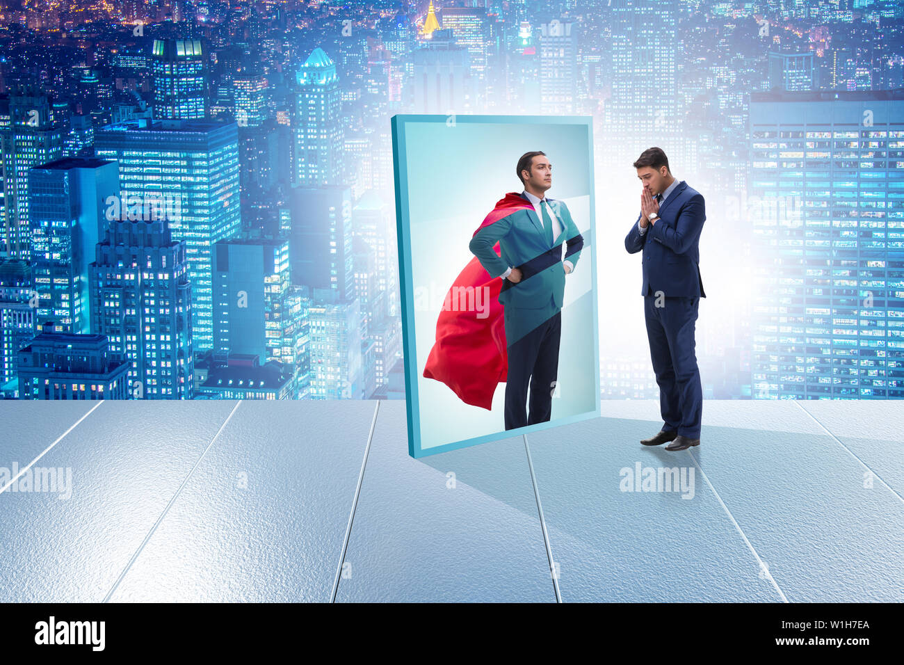 Businessman seeing himself in mirror as superhero Stock Photo - Alamy