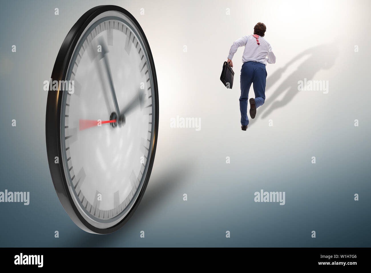 Businessman employee in time management concept Stock Photo - Alamy